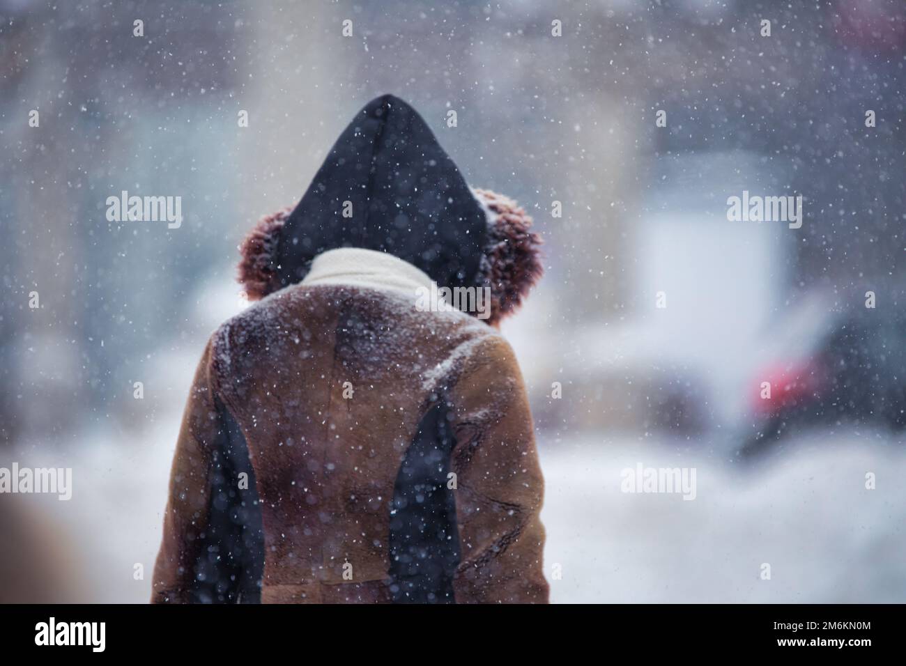 Man outdoors in winter clothes during blizzard and heavy snowfall ...