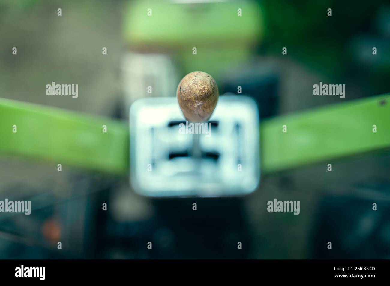 Gear lever on a walk-behind tractor close-up on a blurred background ...