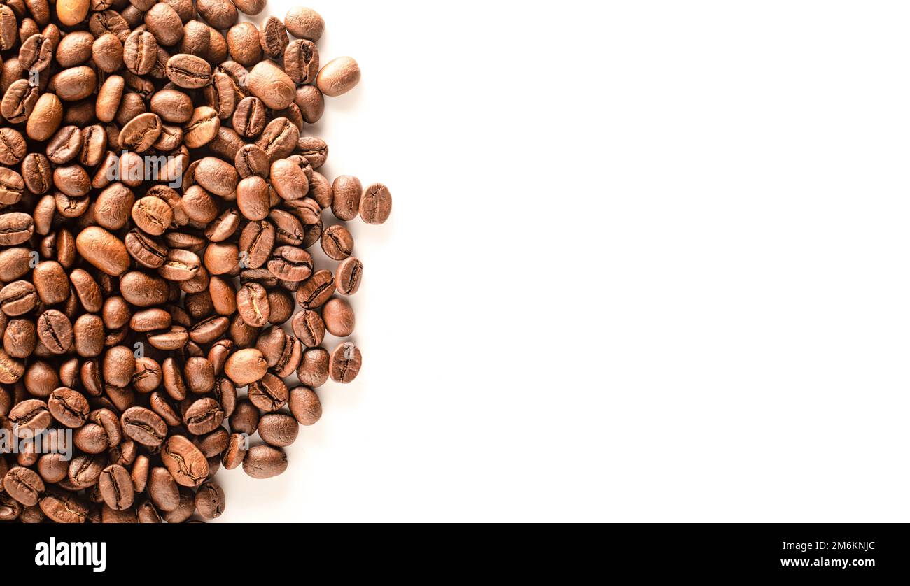 Coffee beans initially cover the white background. View from above ...