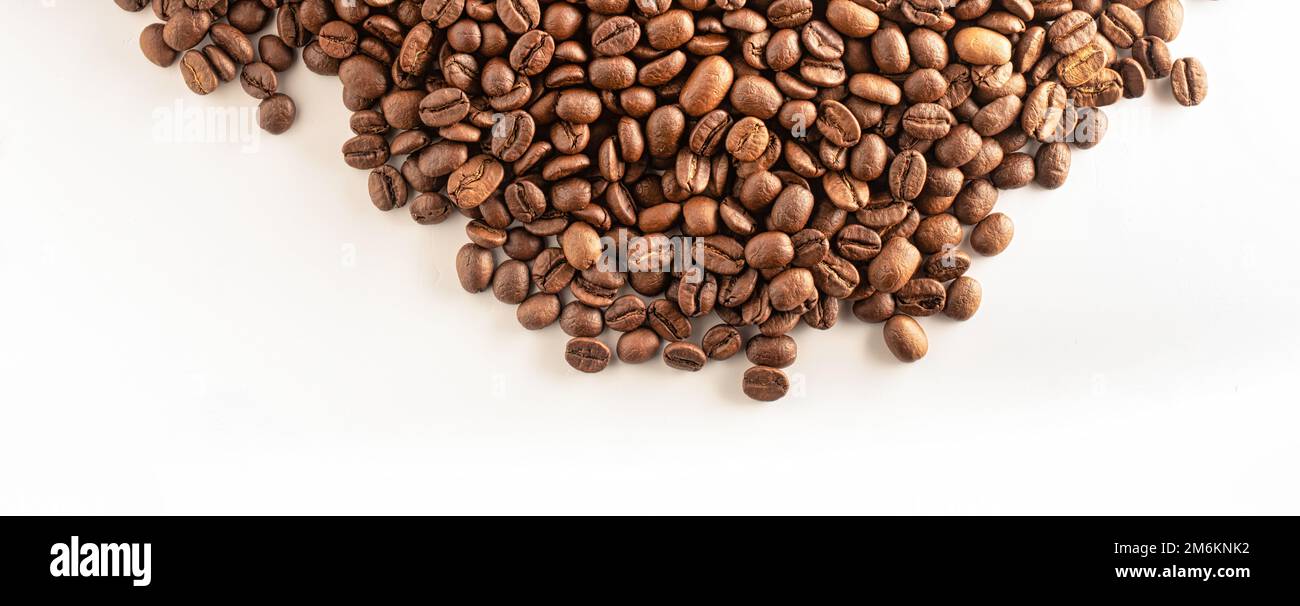 Coffee beans initially cover the white background. View from above ...