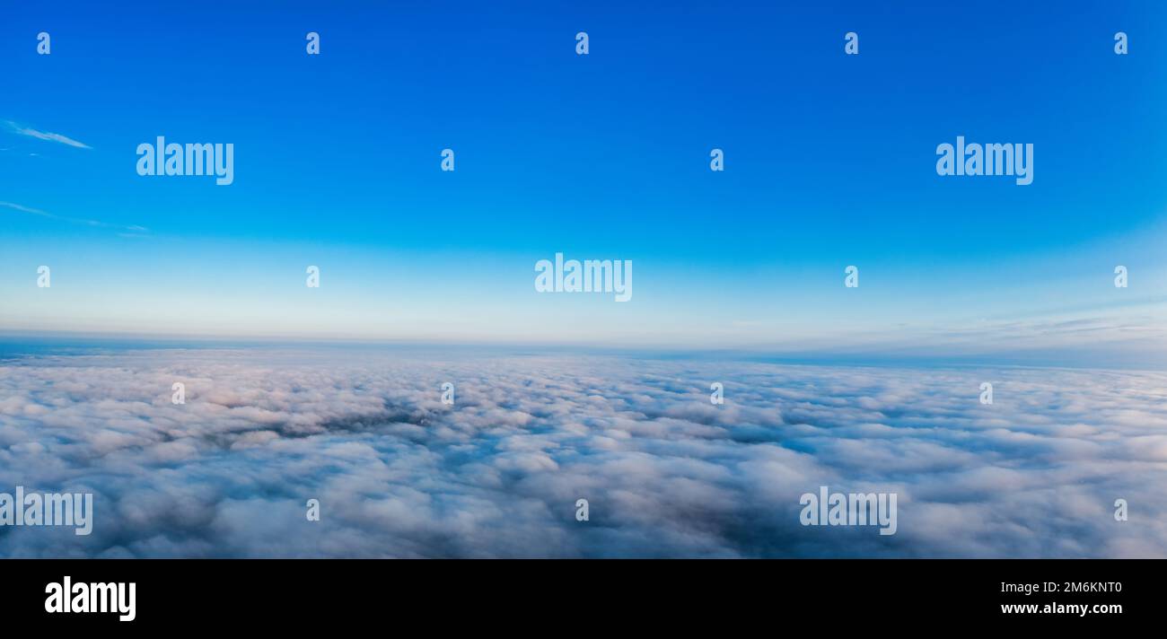 A wonderful bright dawn, above the clouds. Drone flight over the dawn ...
