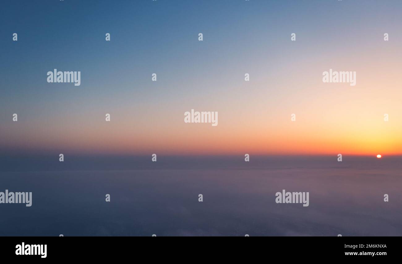 A wonderful bright dawn, above the clouds. Drone flight over the dawn ...