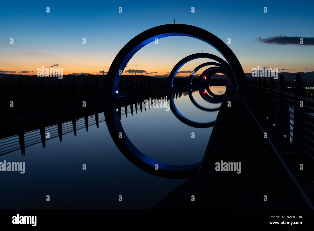 View of the Falkirk Wheel at sunset with lights in different bright ...