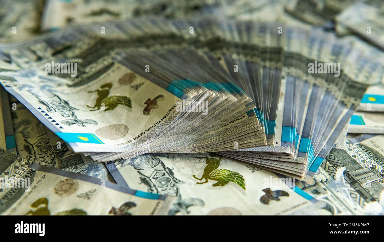 Thick wad of money cash on table Stock Photo - Alamy