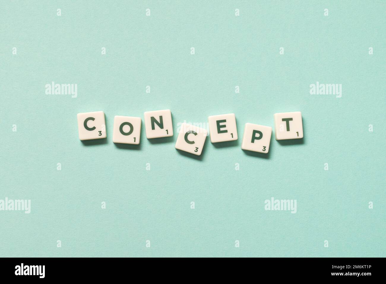 Concept formed of scrabble blocks on turquoise background Stock Photo ...