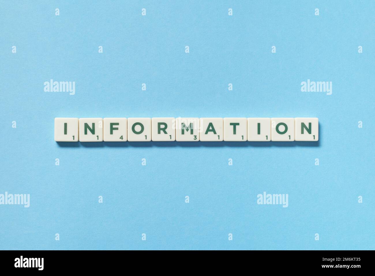 Information formed of scrabble blocks on blue background Stock Photo ...