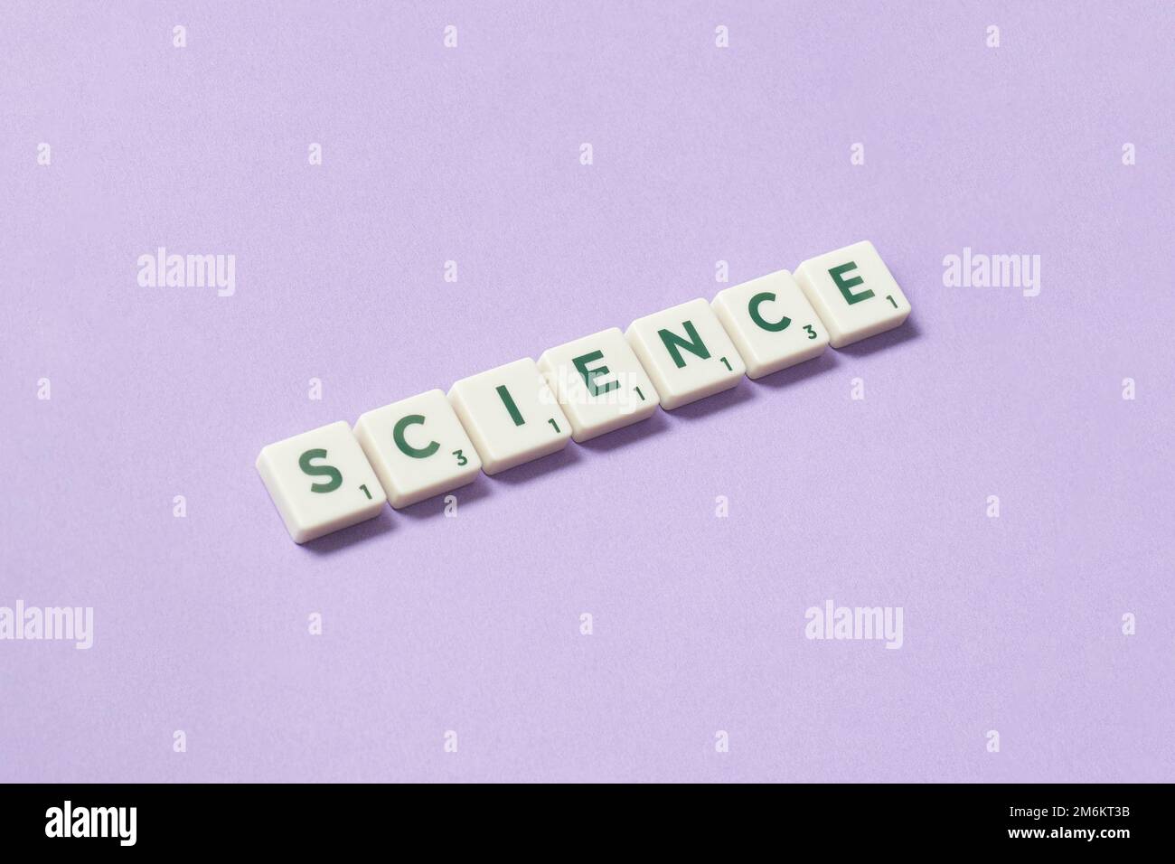 Science formed of scrabble elements on lilac background Stock Photo - Alamy