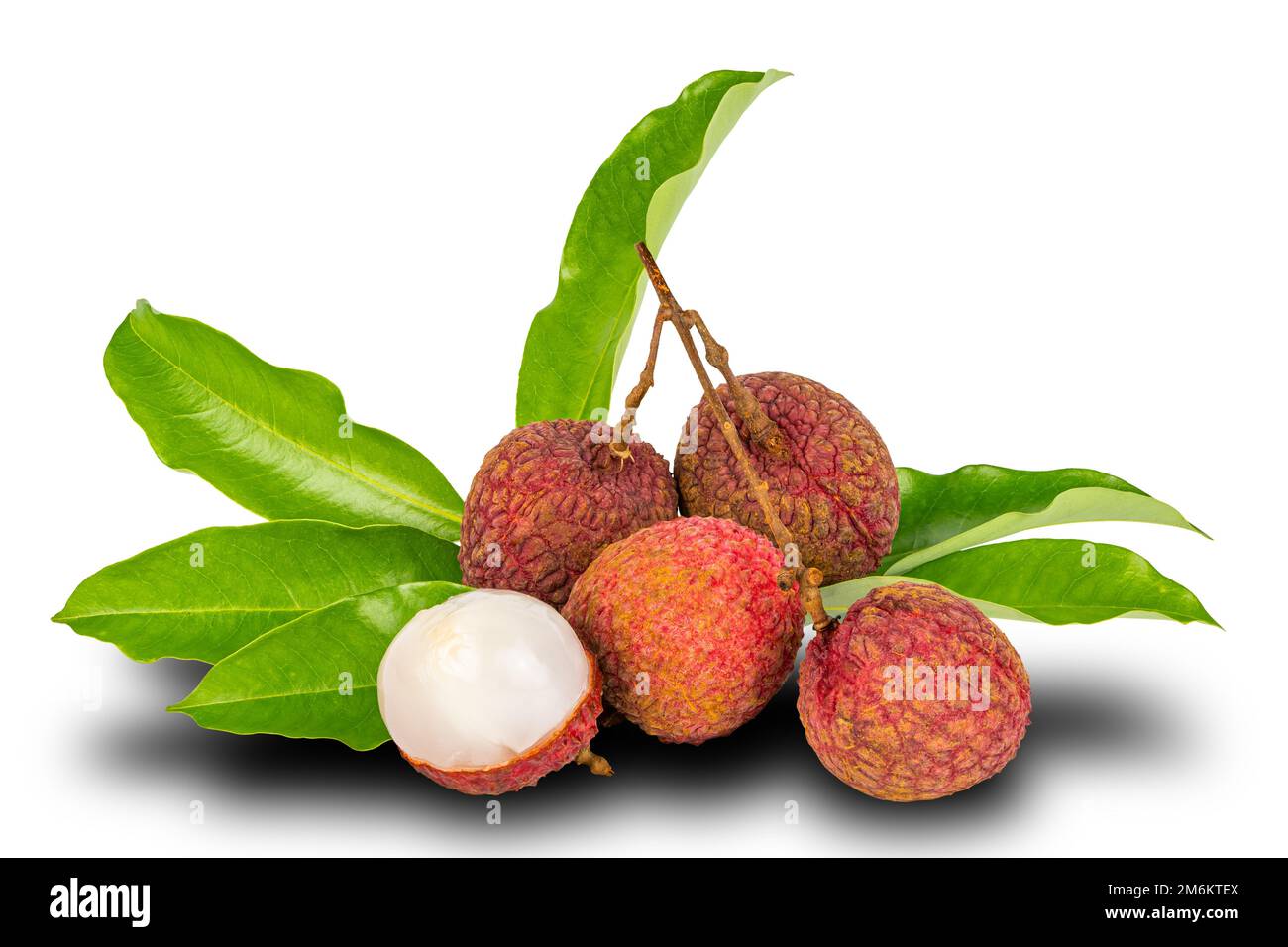 Bunch of ripe lychee and a half with green leaves isolated on white ...