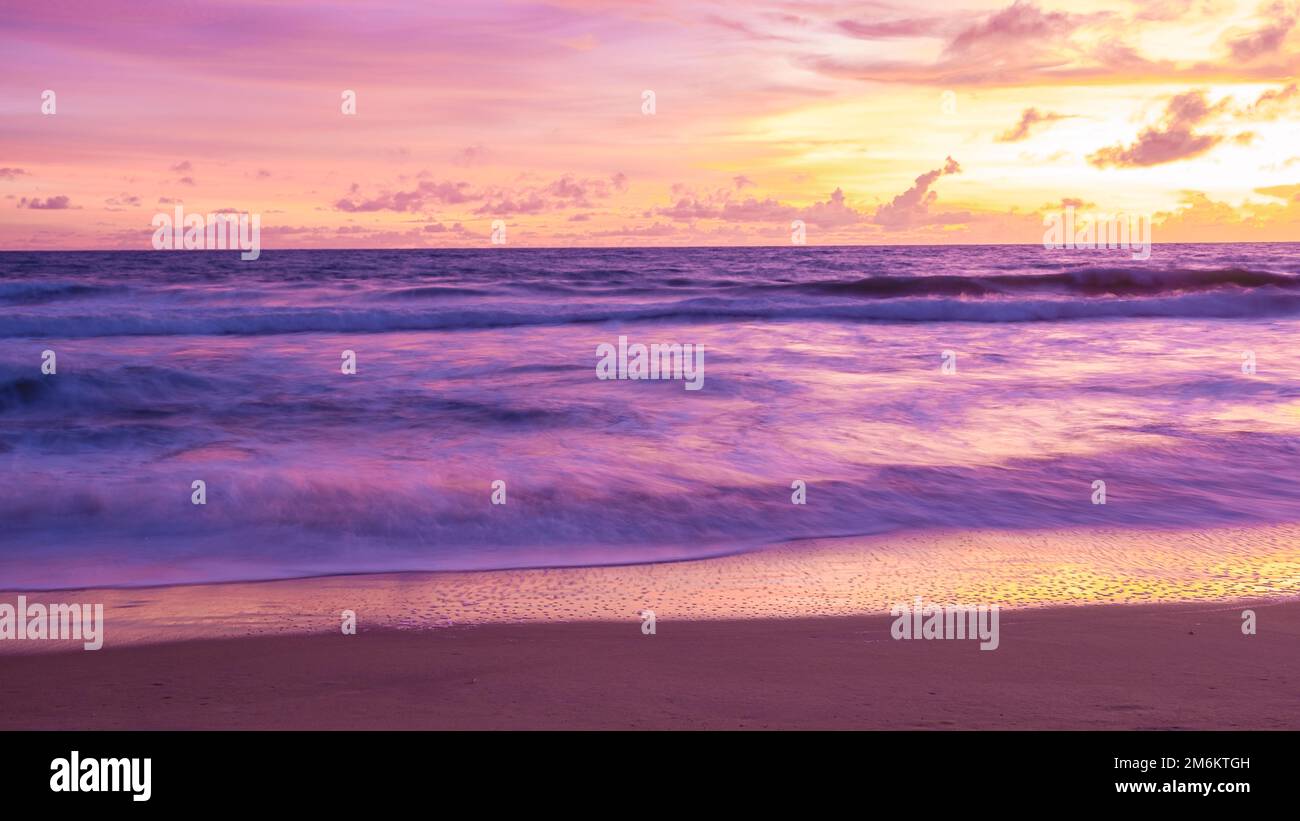 Sunset on the beach of Phuket Thailand Stock Photo - Alamy