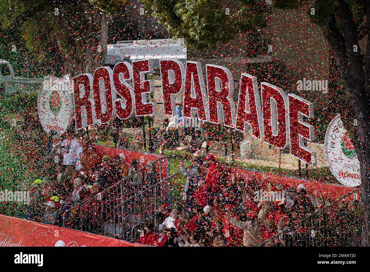 Spectators view the 134th annual Rose Parade. Spectators and floats ...
