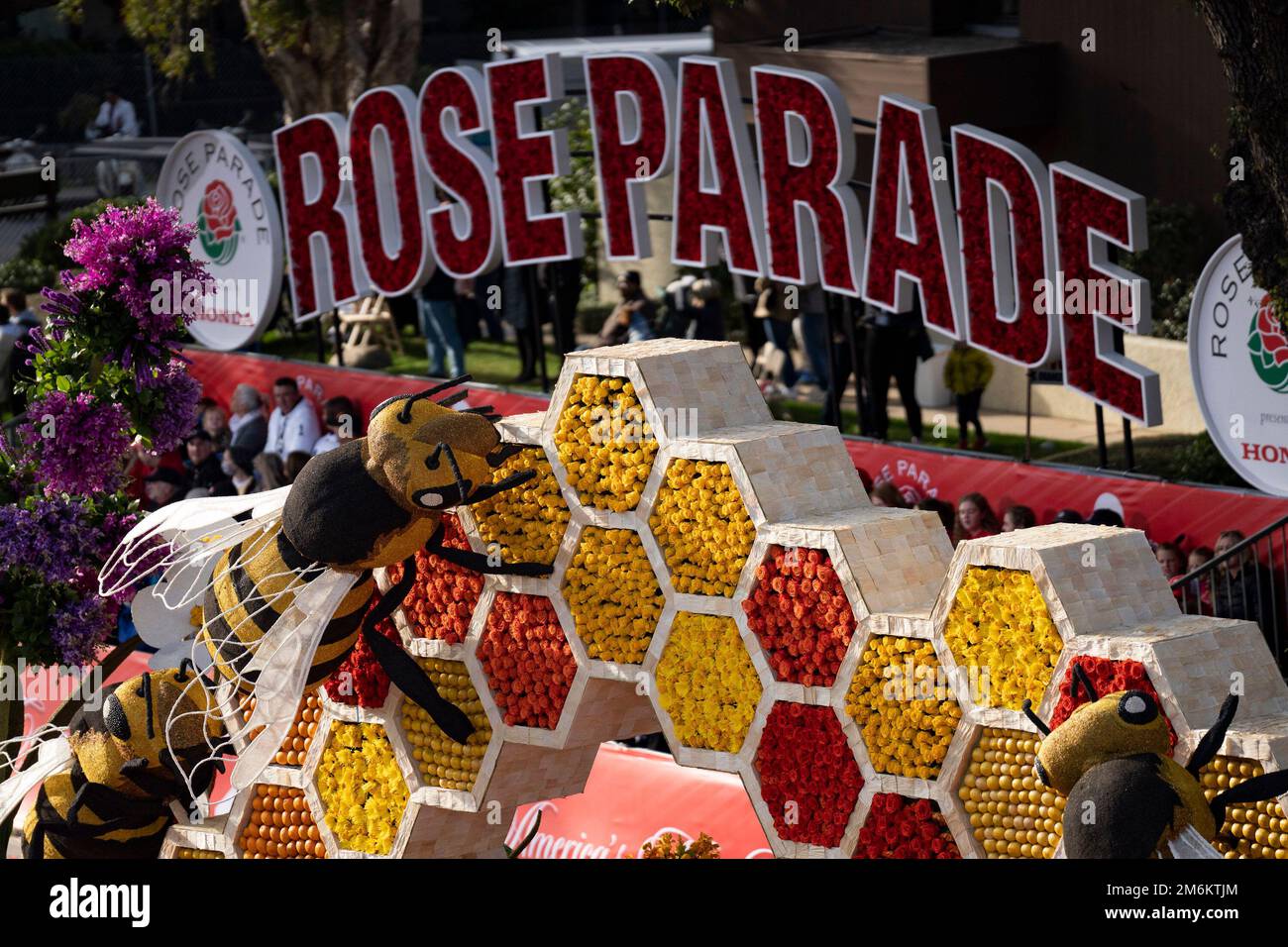 A bee float progresses down the street during the 134th annual Rose ...