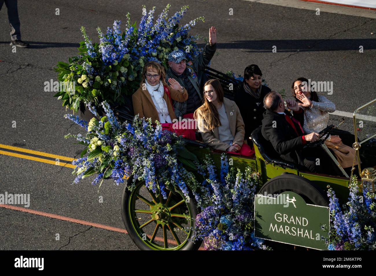 Gabby Giffords and Mark Kelly wave to the crowd during the 134th annual ...