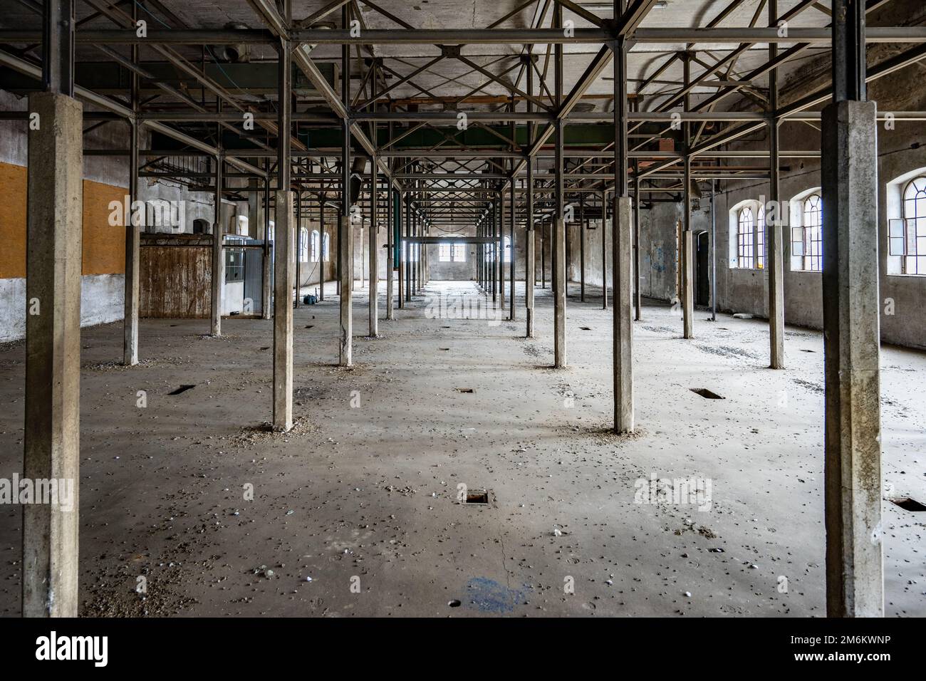 Storage rooms of a historic flour mill with cast iron columns Stock ...