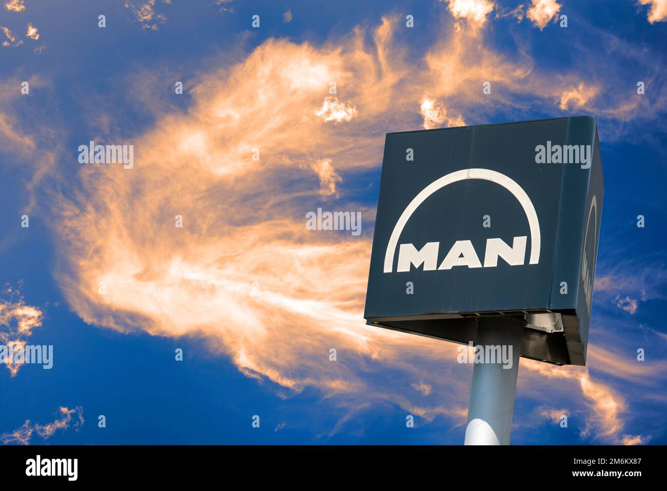 Advertising sign with the logo of the company MAN Stock Photo - Alamy