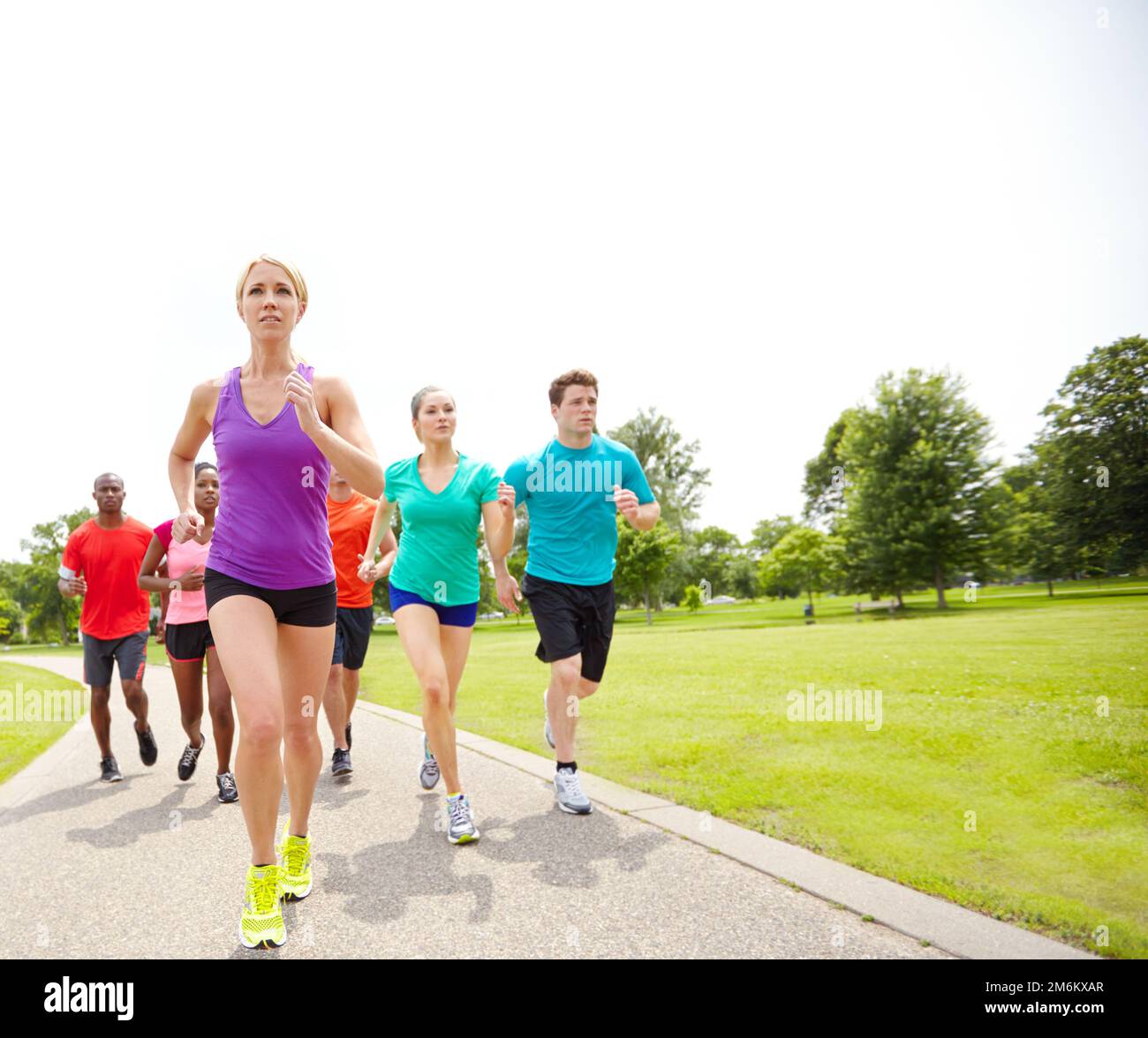 Promoting a healthy habit. Front view of a group of male and female ...