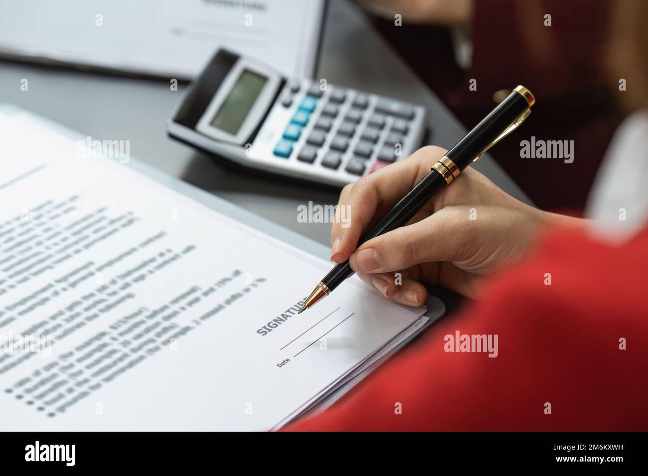 Businesswoman holding and force hand of employee to sign up illegal ...