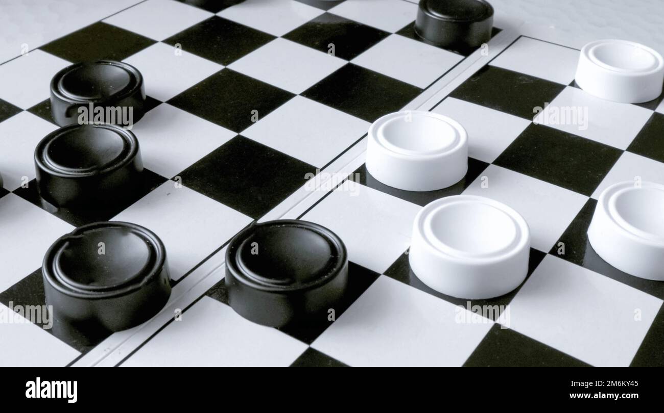 Checkers game, hobby. Close-up of a hand moving checkers, fast shooting ...