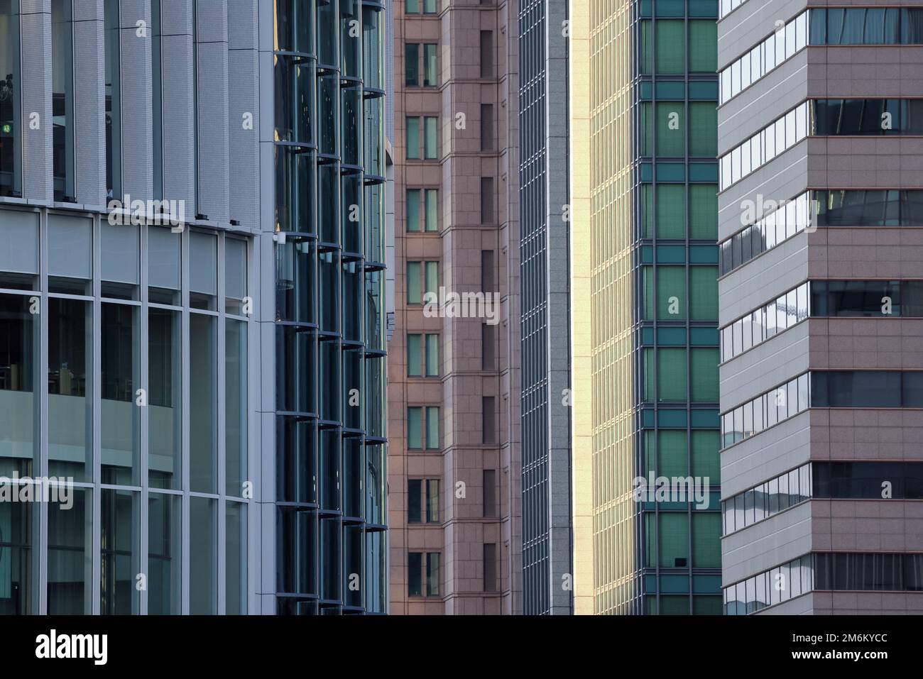 Early morning sun hits glass office buildings in financial district ...