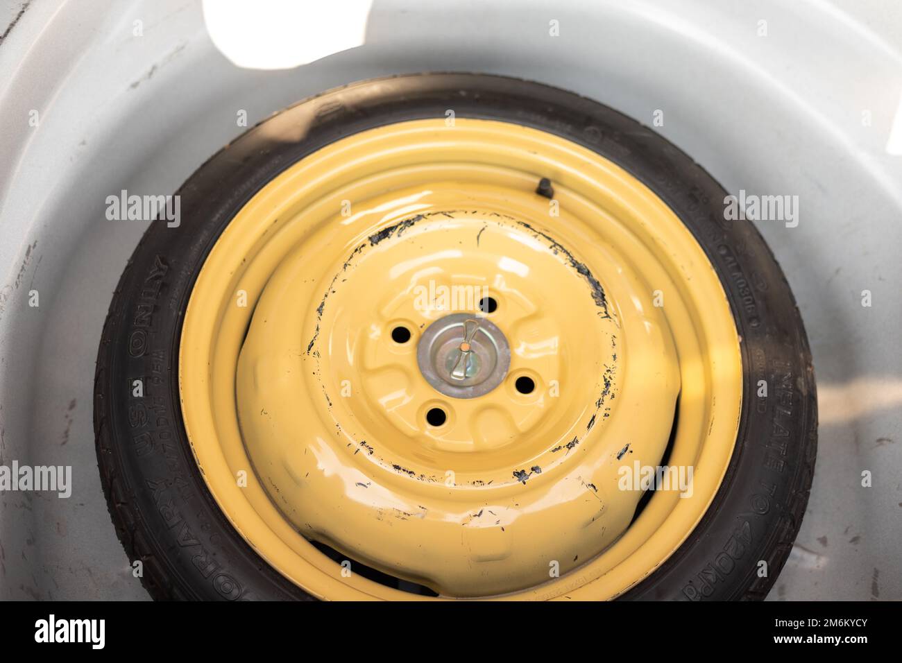 Spare tyre in the car boot for temporary use only Stock Photo - Alamy