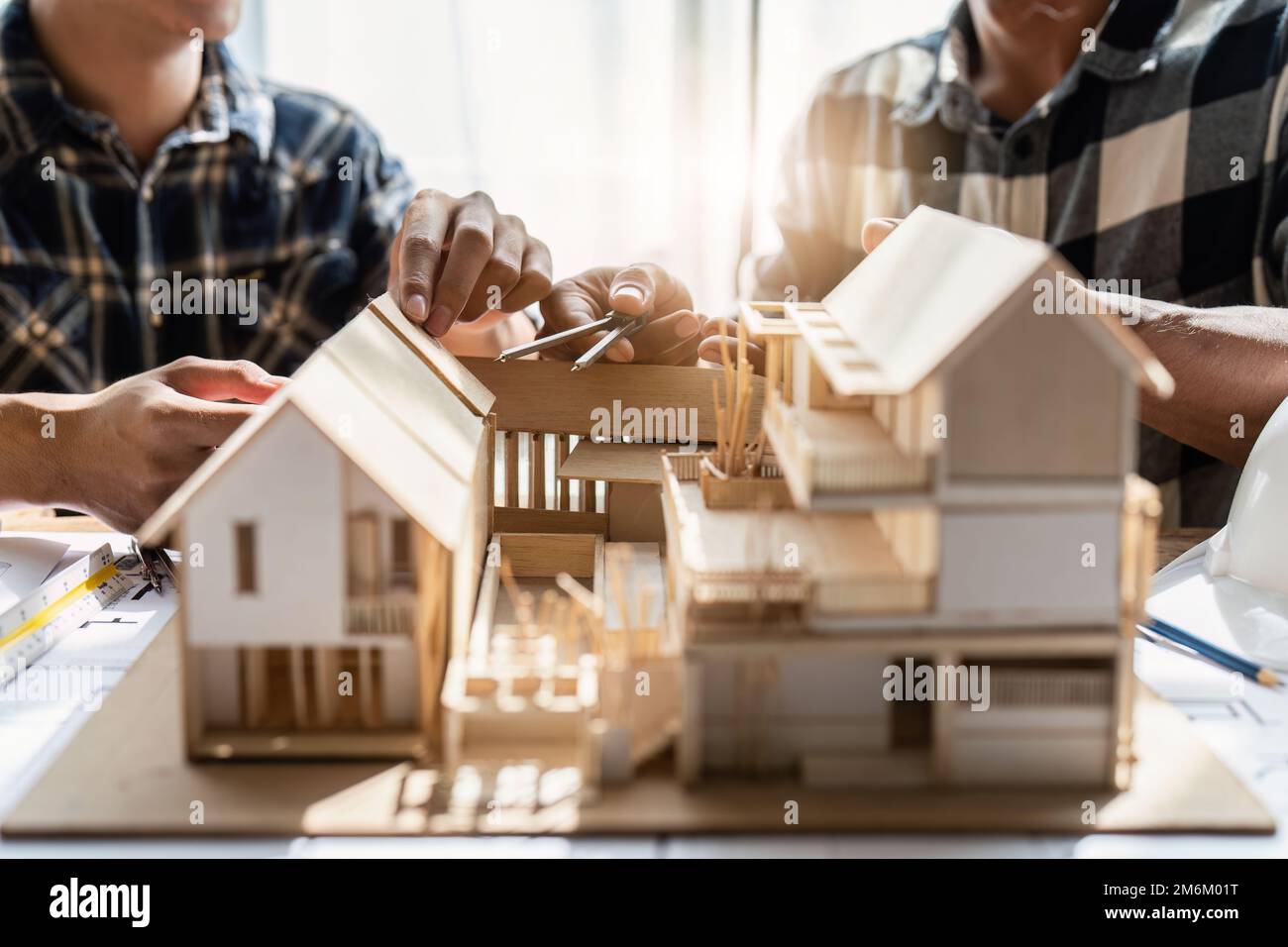 Architecture team drawing something while working with blueprint in the ...