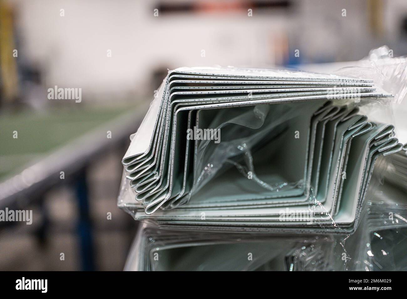 Metal flashing in metal roofing factory workshop Stock Photo - Alamy