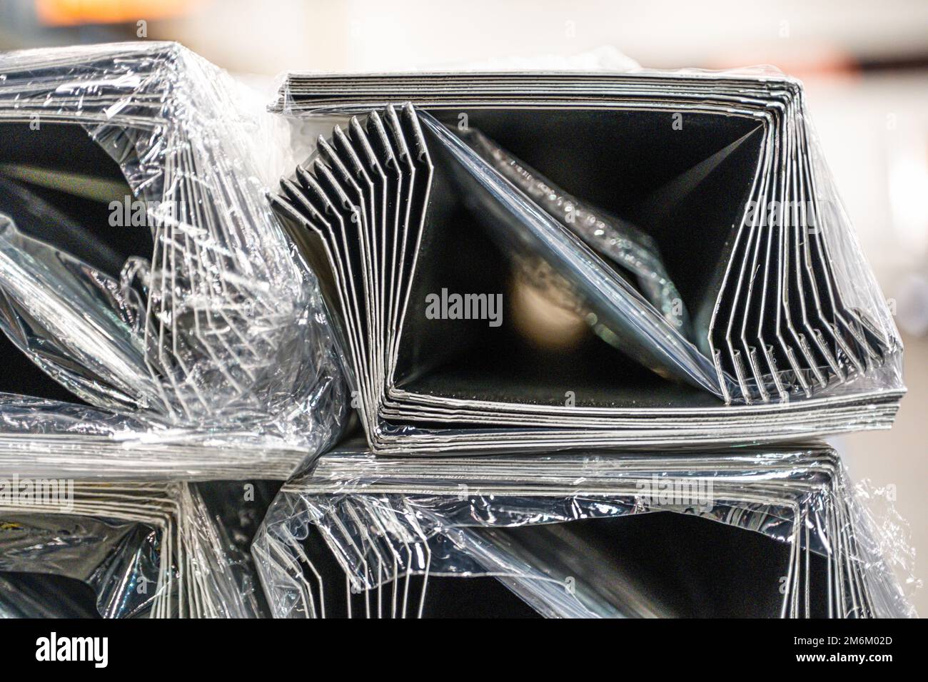 Metal flashing in metal roofing factory workshop Stock Photo - Alamy