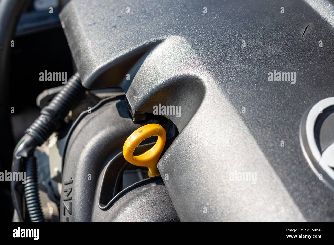 Yellow spigot for pulling out to check the oil level in car engine ...