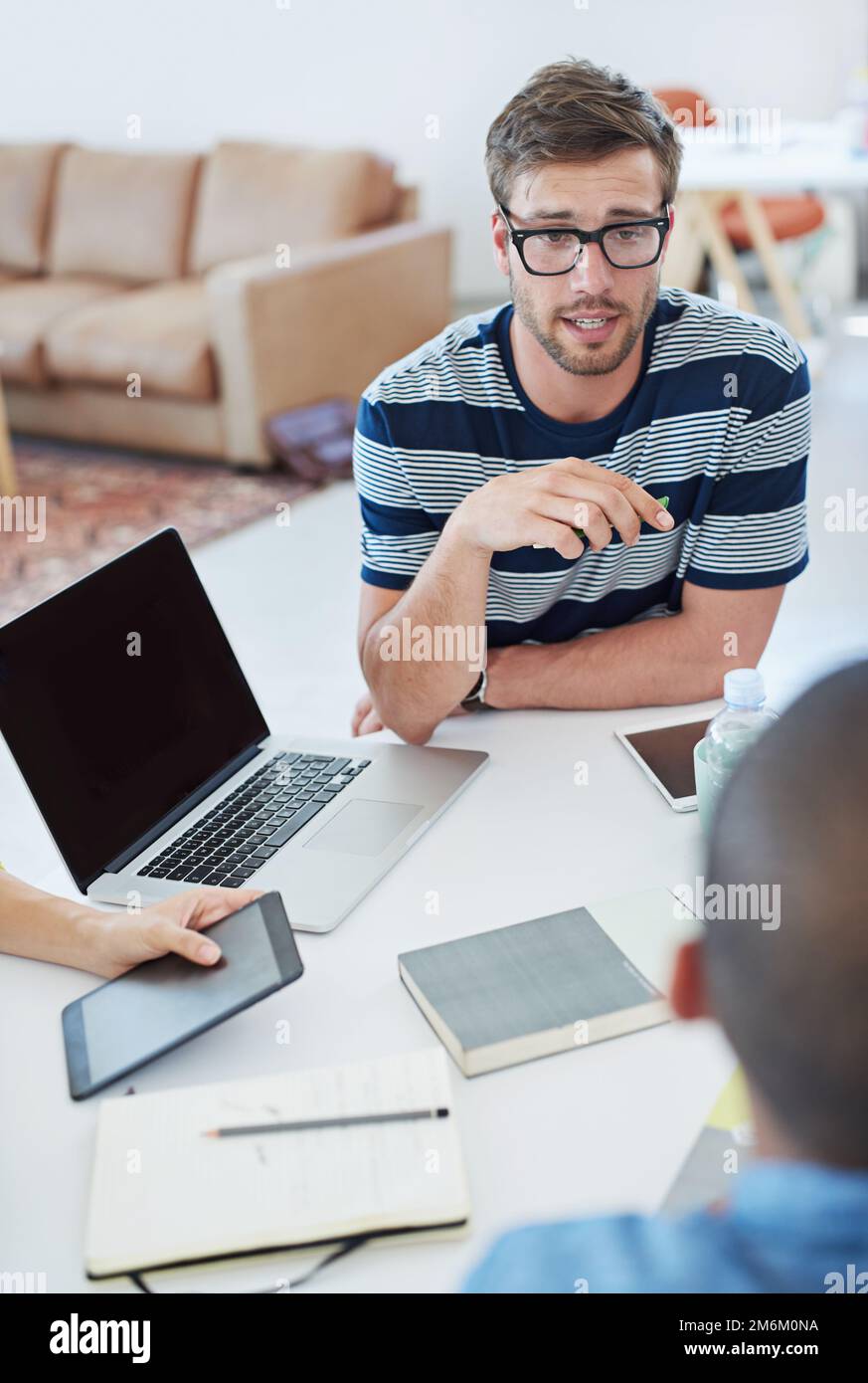 Modern young professionals. a group of young designers at work in an ...