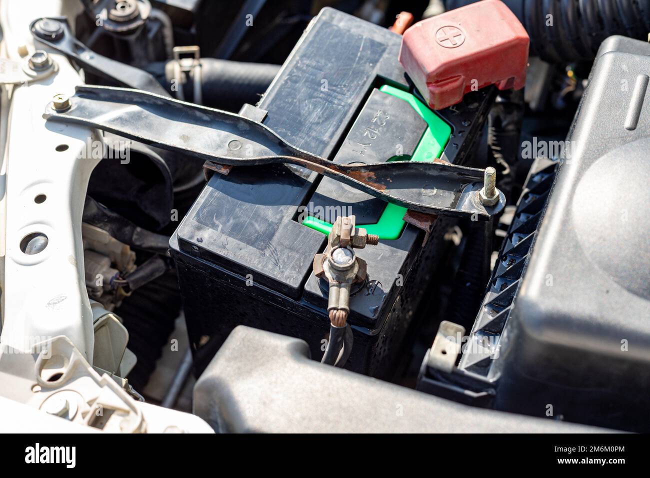 Battery of a car in the bonnet Stock Photo - Alamy