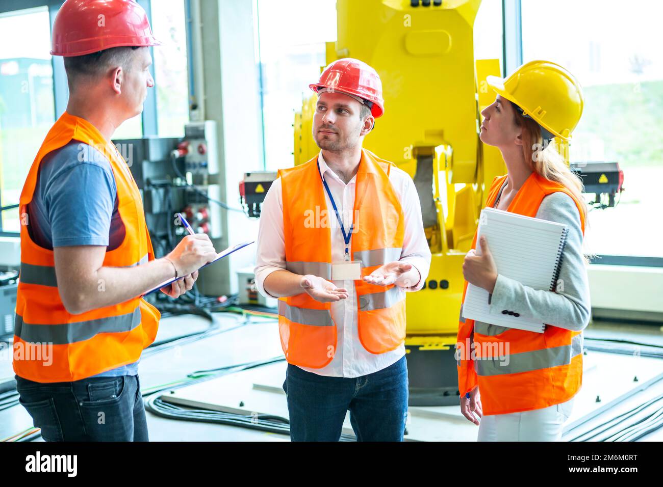 Engineers Consulting Industrial Robot Stock Photo - Alamy