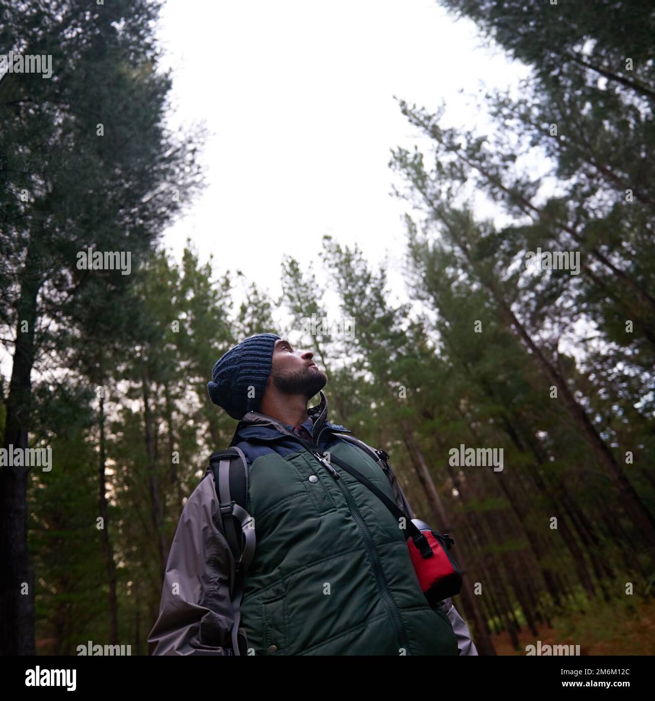 Get out to get inspired. Low angle view of a handsome rugged man ...