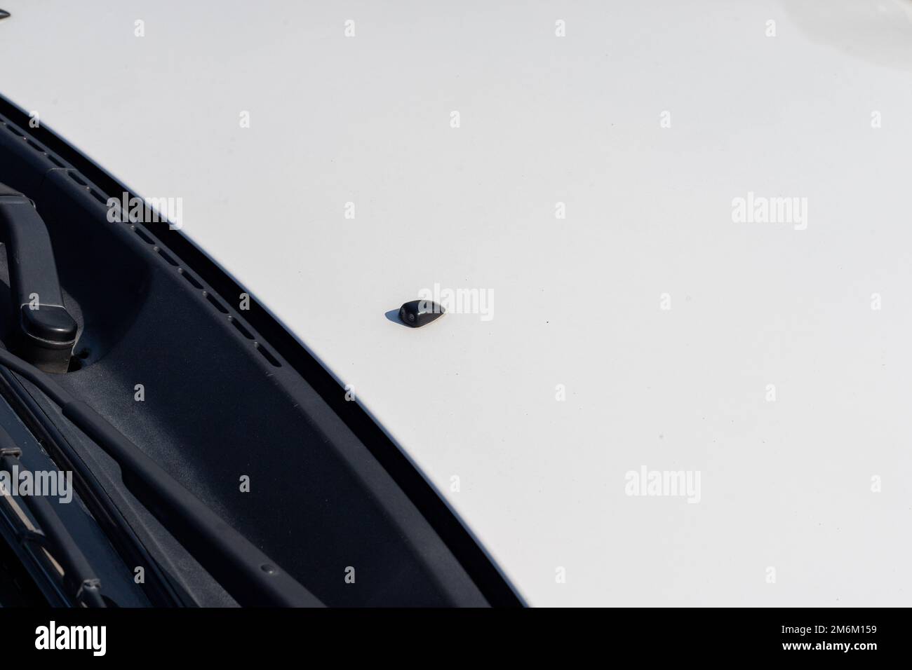 windshield washer nozzle over car bonnet closeup Stock Photo - Alamy