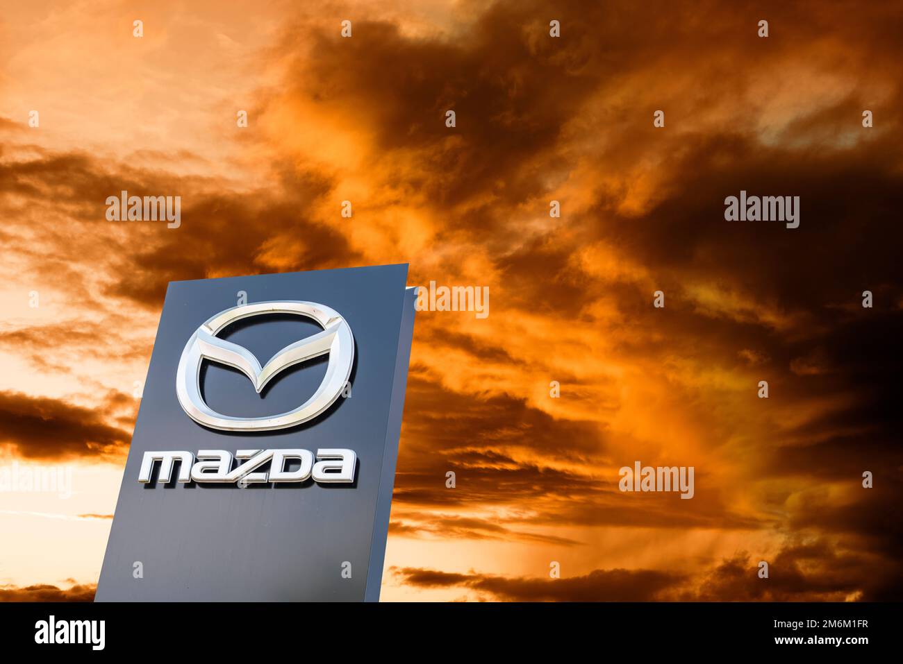 Advertising and company sign of the company MAZDA Stock Photo - Alamy