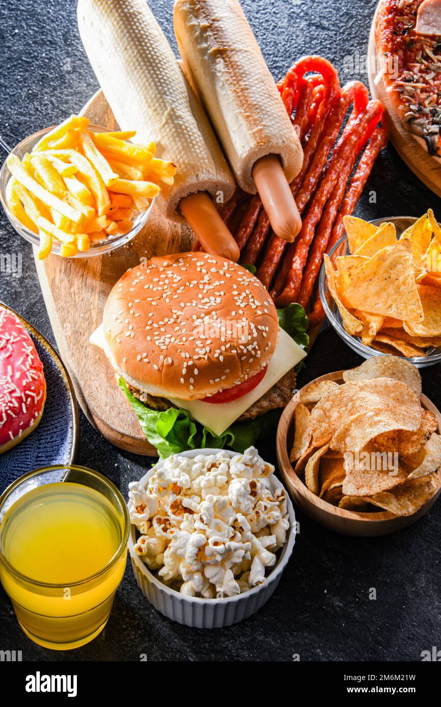 Foods enhancing the risk of cancer. Junk food Stock Photo - Alamy
