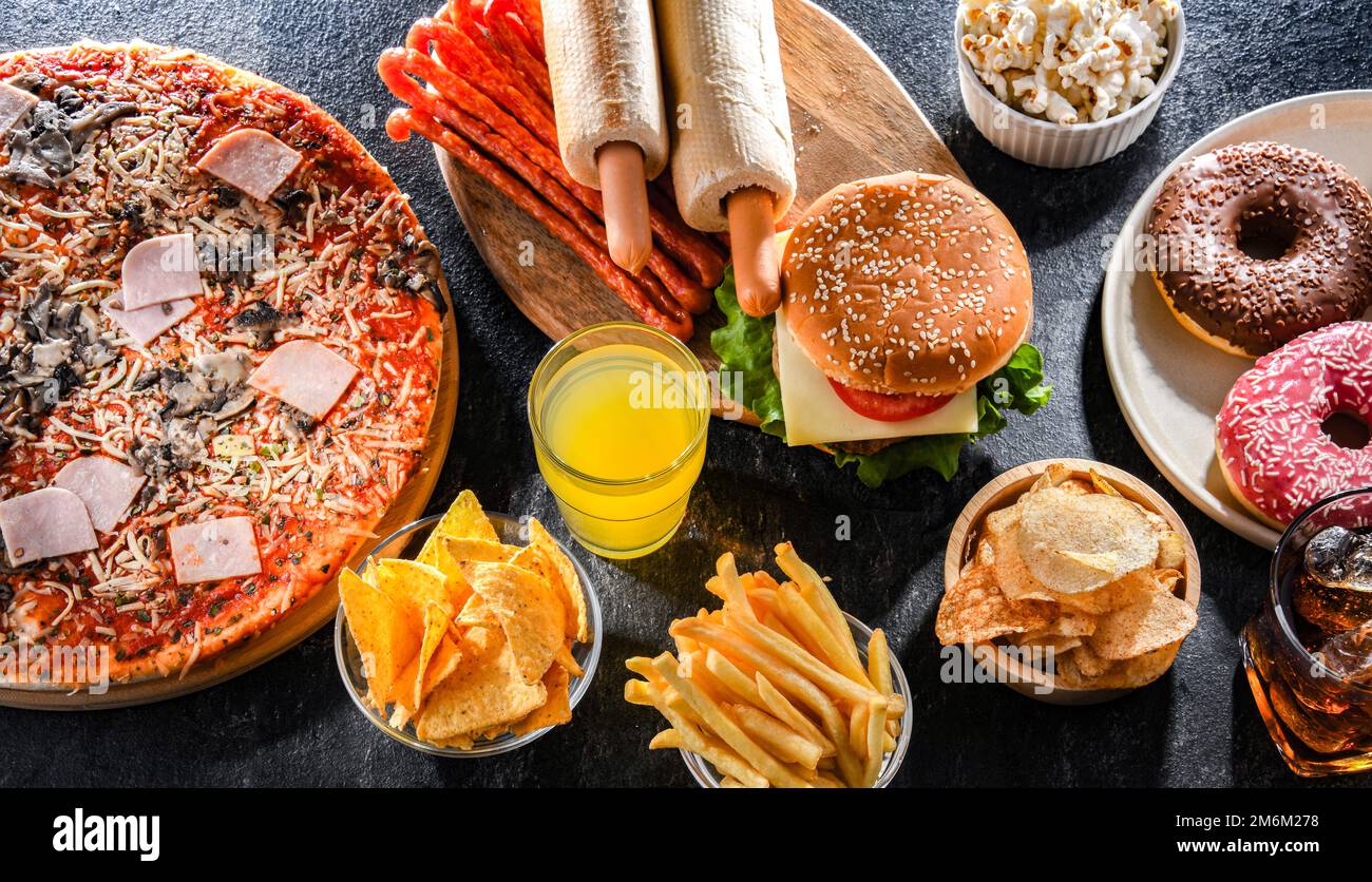 Foods enhancing the risk of cancer. Junk food Stock Photo - Alamy
