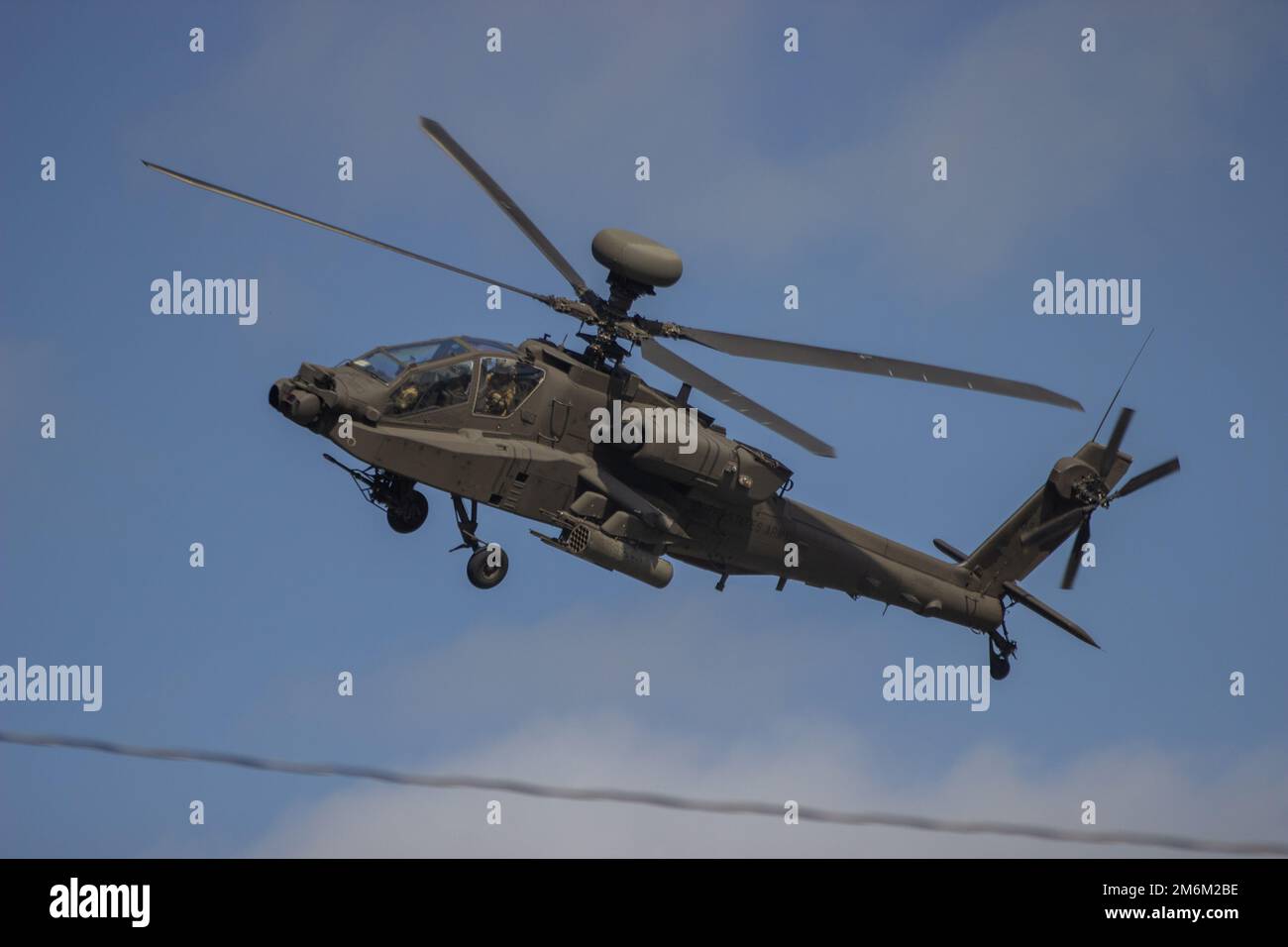 An AH-64 Apache flies overhead during Operation Thunderstrike ...