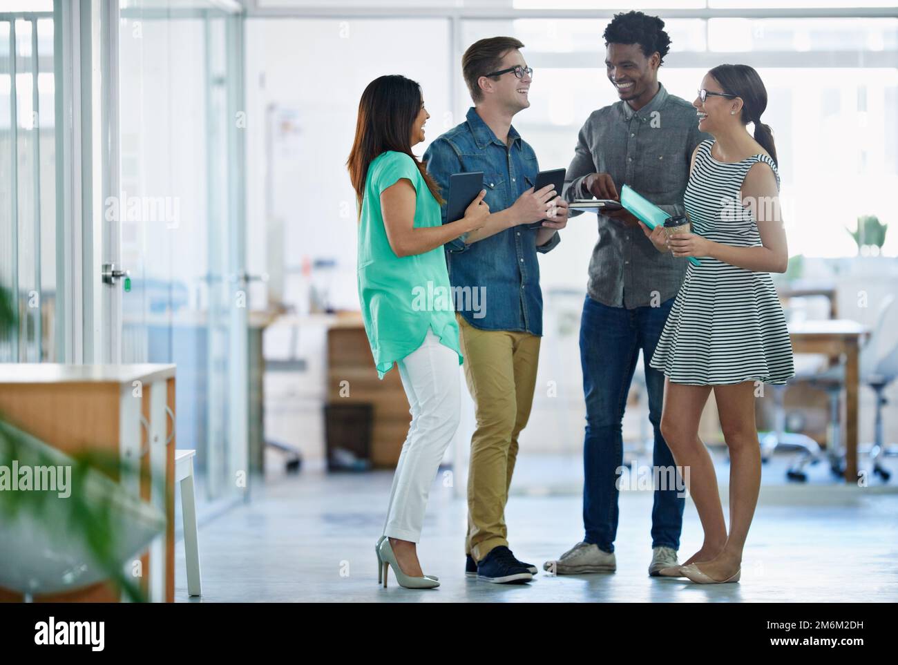 Female coworkers laughing hi-res stock photography and images - Alamy