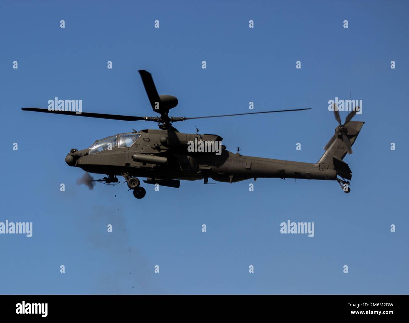 An AH-64 Apache fires rounds during the Operation Thunderstrike ...