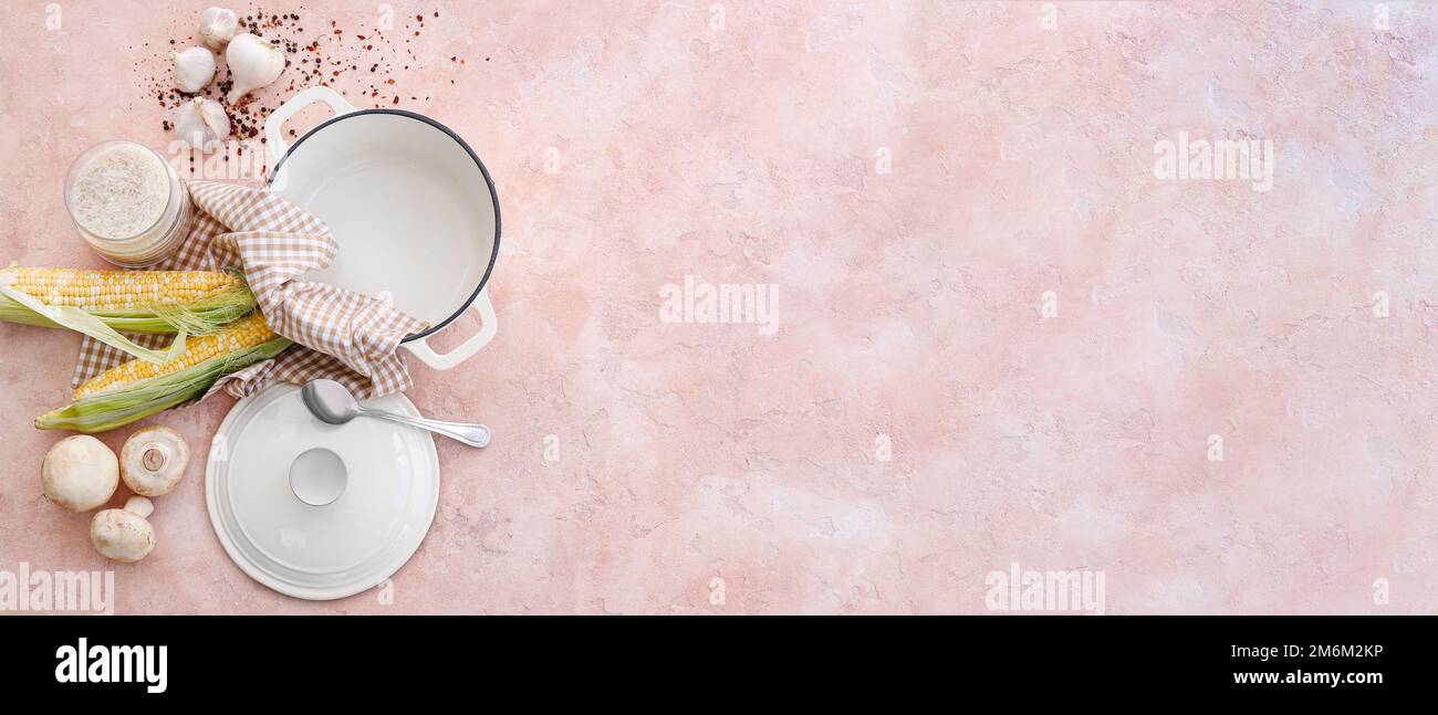 Ceramic cooking pot and ingredients on grunge background with space for ...
