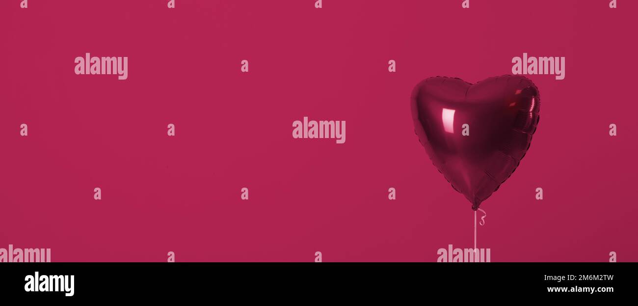 Heart shaped balloon on color background with space for text. Valentine ...