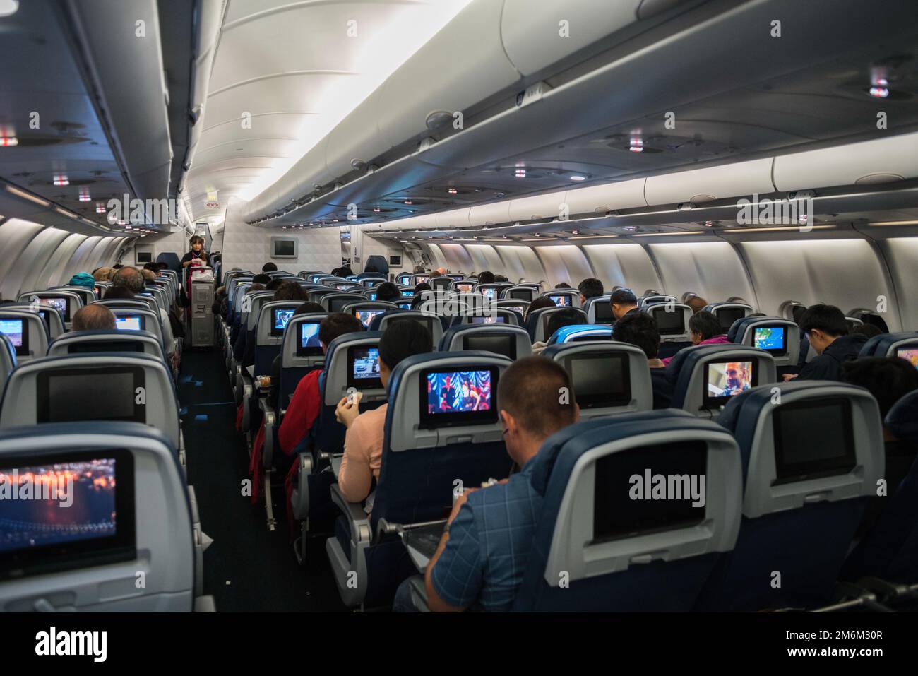 Commercial aircraft cabin interior Stock Photo - Alamy