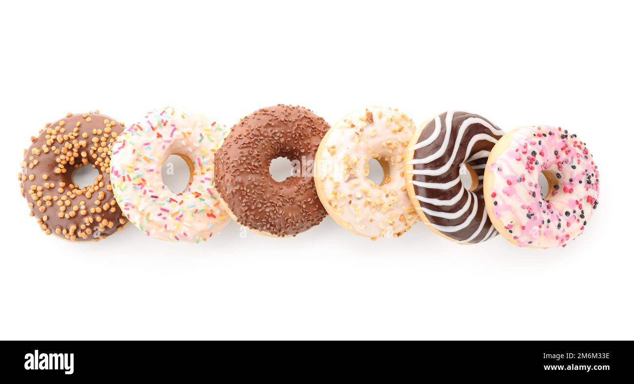 Many different donuts on white background Stock Photo - Alamy