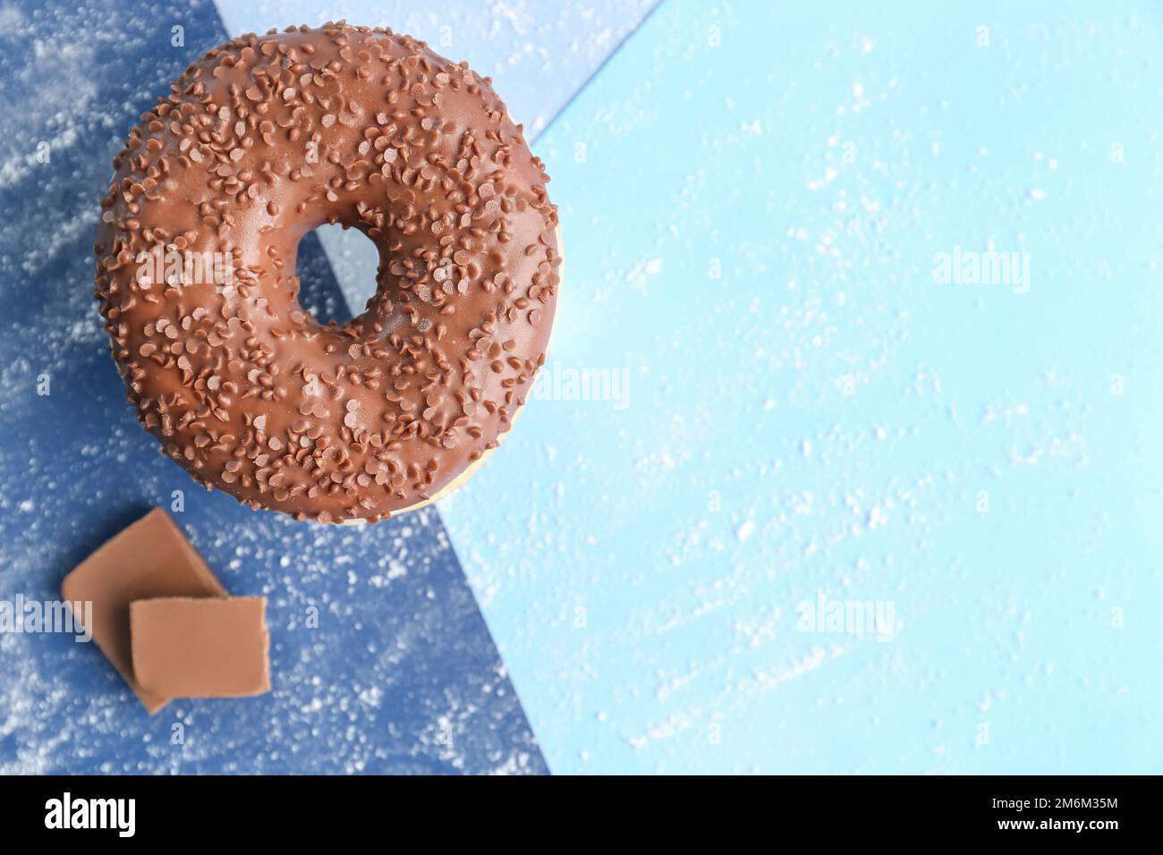 Sweet chocolate donut on color background Stock Photo - Alamy