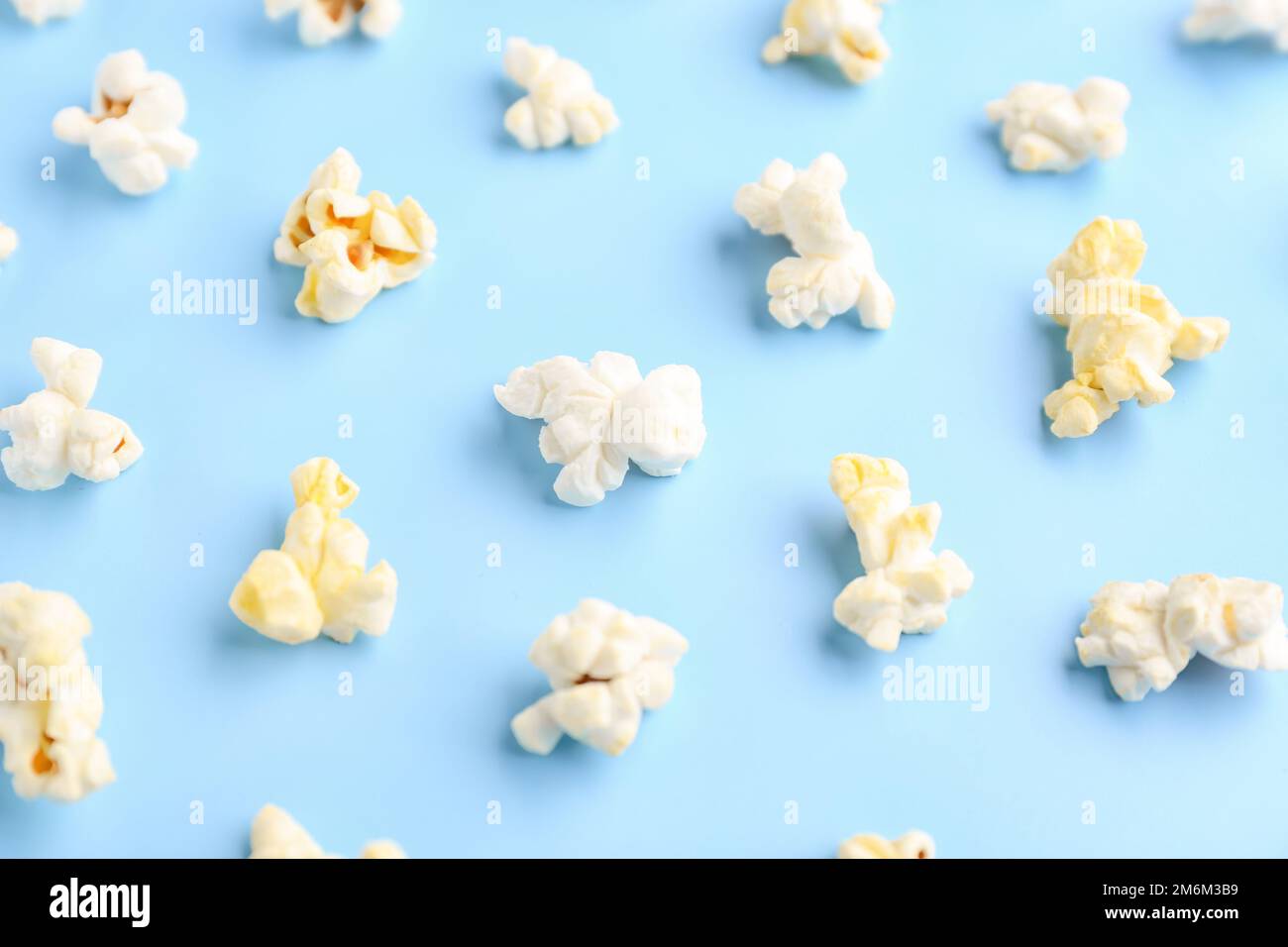 Delicious popcorn on blue background Stock Photo - Alamy