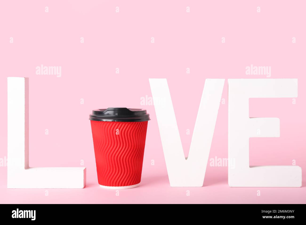 Word LOVE with cup of coffee on pink background. Valentine's Day ...