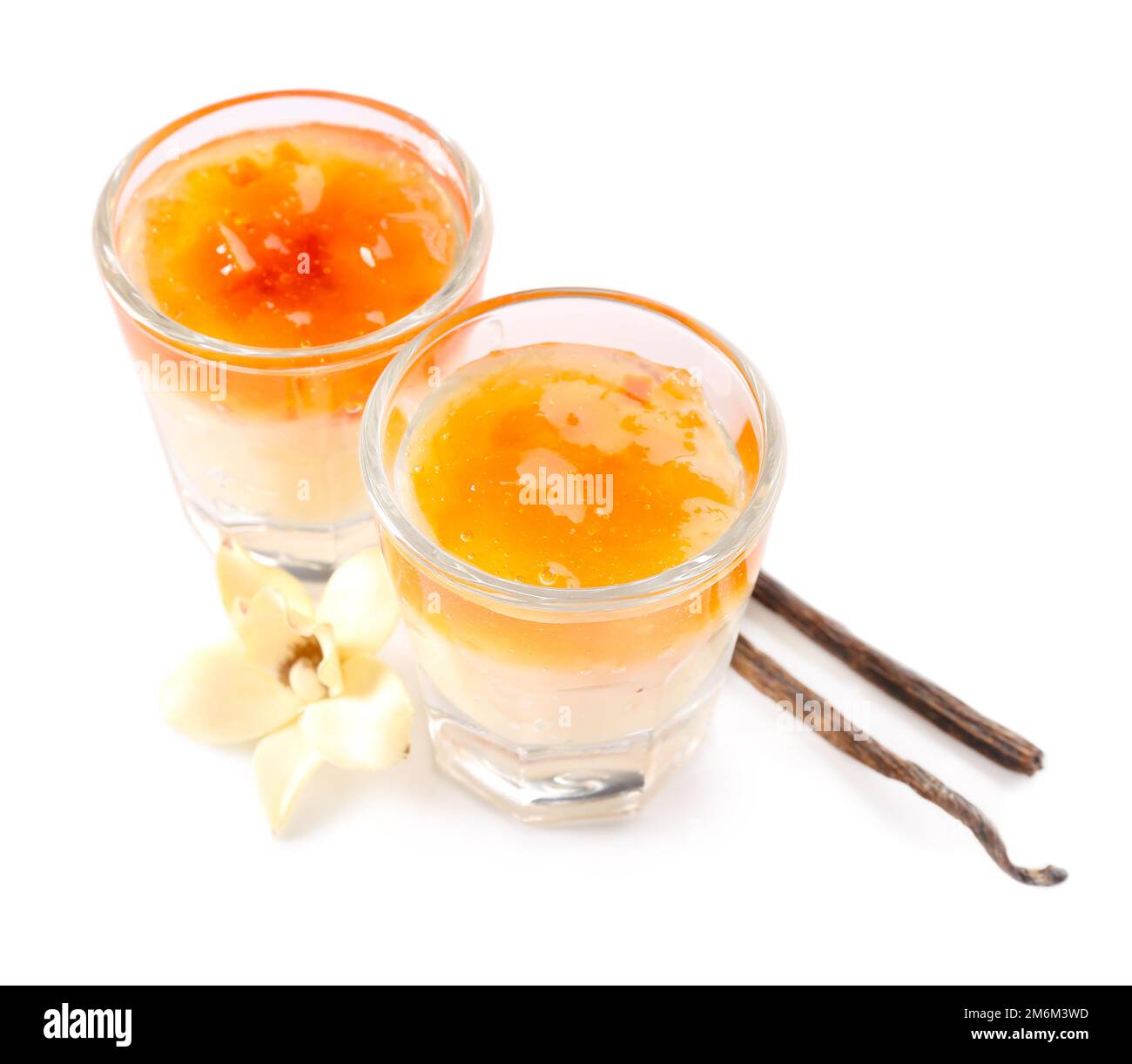 Shots of delicious pudding with jam and vanilla sticks isolated on ...