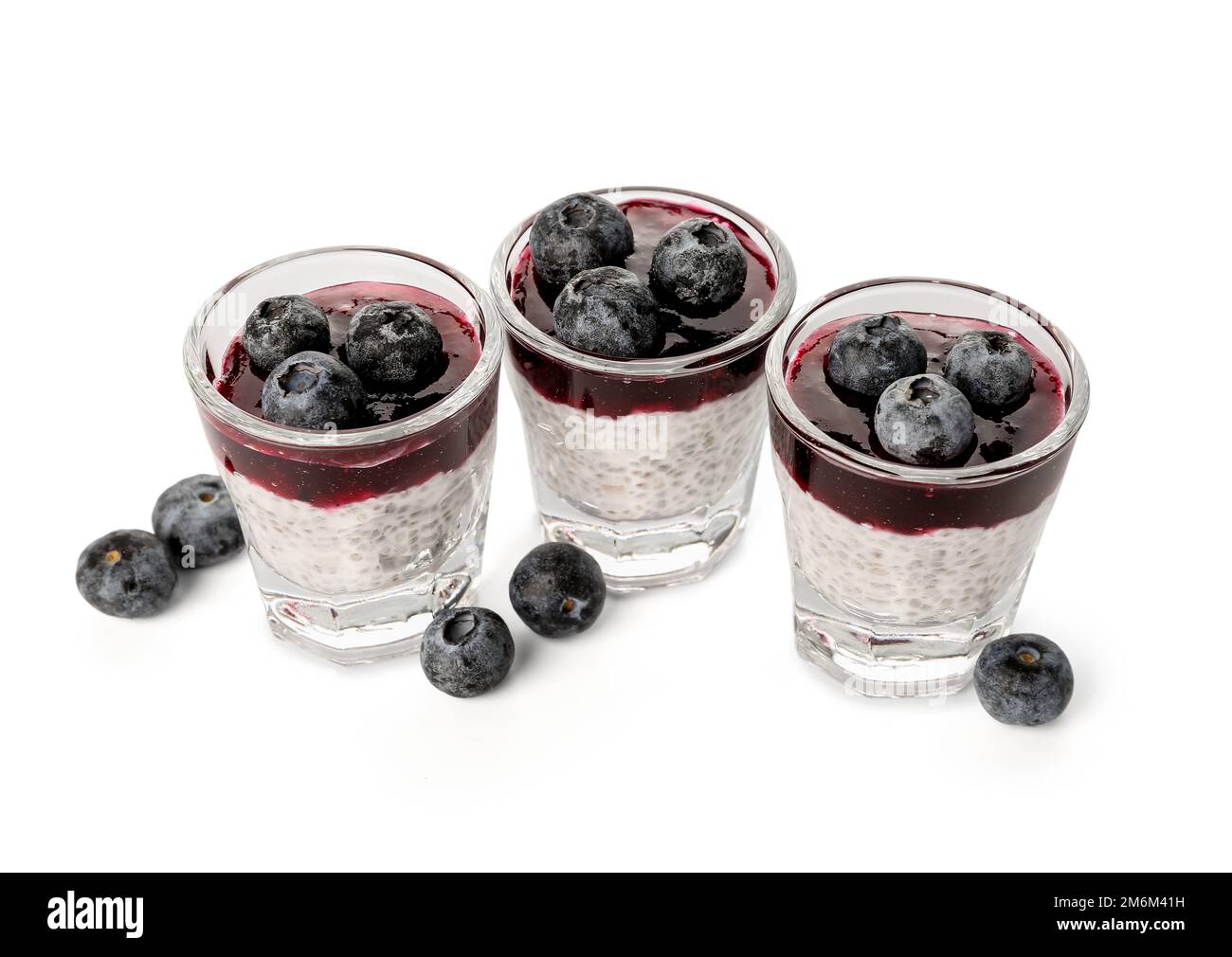 Shots of delicious chia seed pudding with blueberry isolated on white ...