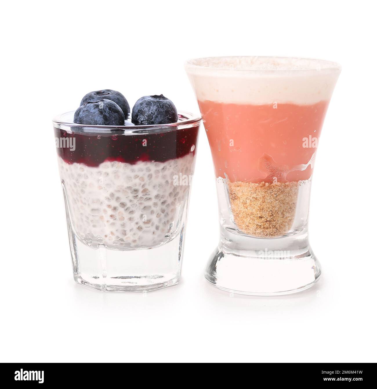 Shots of pudding with coconut shavings, blueberry and chia seeds ...