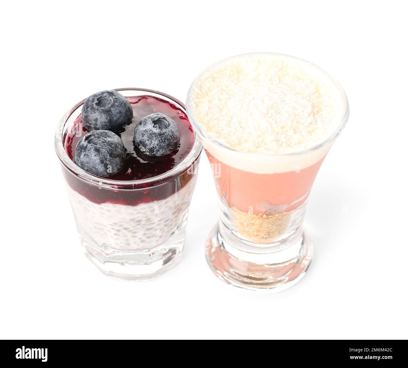 Shots of pudding with coconut shavings, blueberry and chia seeds ...