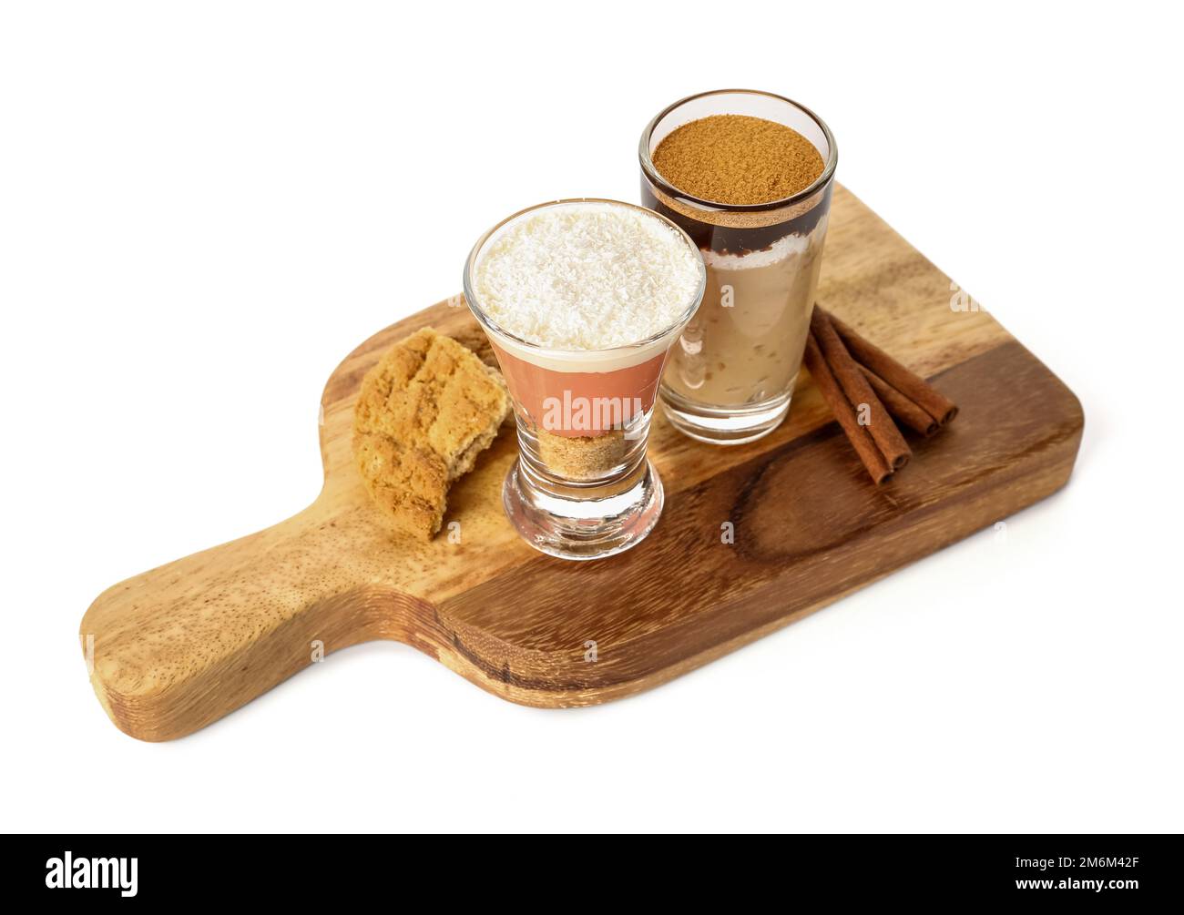 Board with shots of pudding with cookie pieces and cinnamon isolated on ...